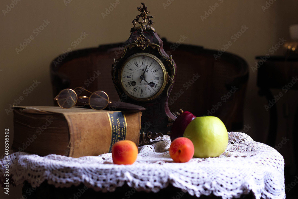 Vintage still life with vintage clock, antique book, antique glasses ...
