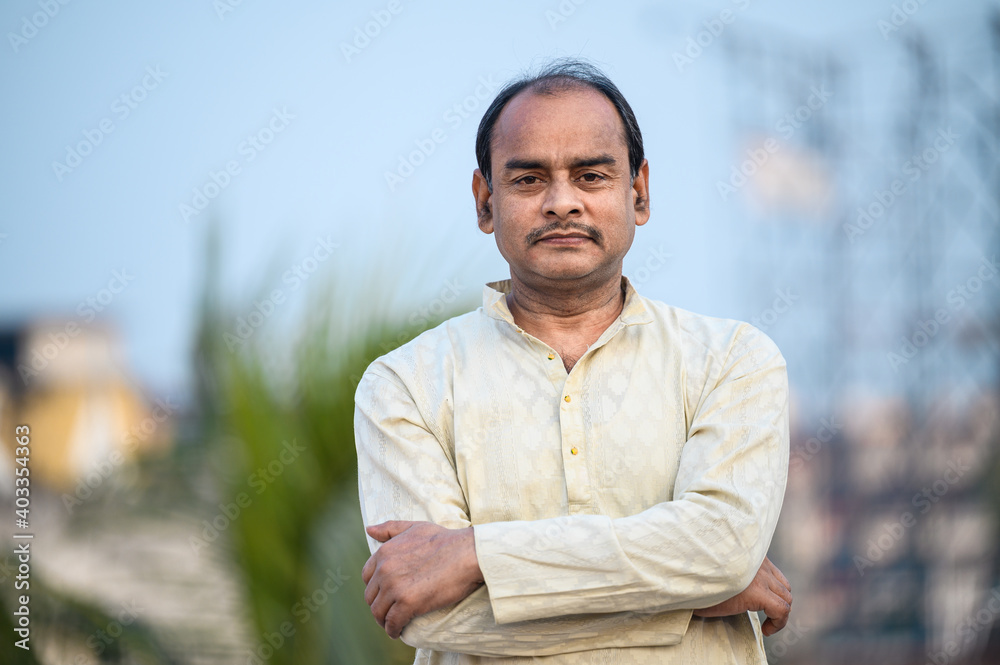 Portrait of a Middle aged Indian Man Stock Photo | Adobe Stock