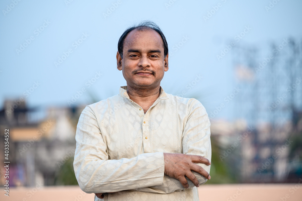Portrait of a Middle aged Indian Man Stock Photo | Adobe Stock