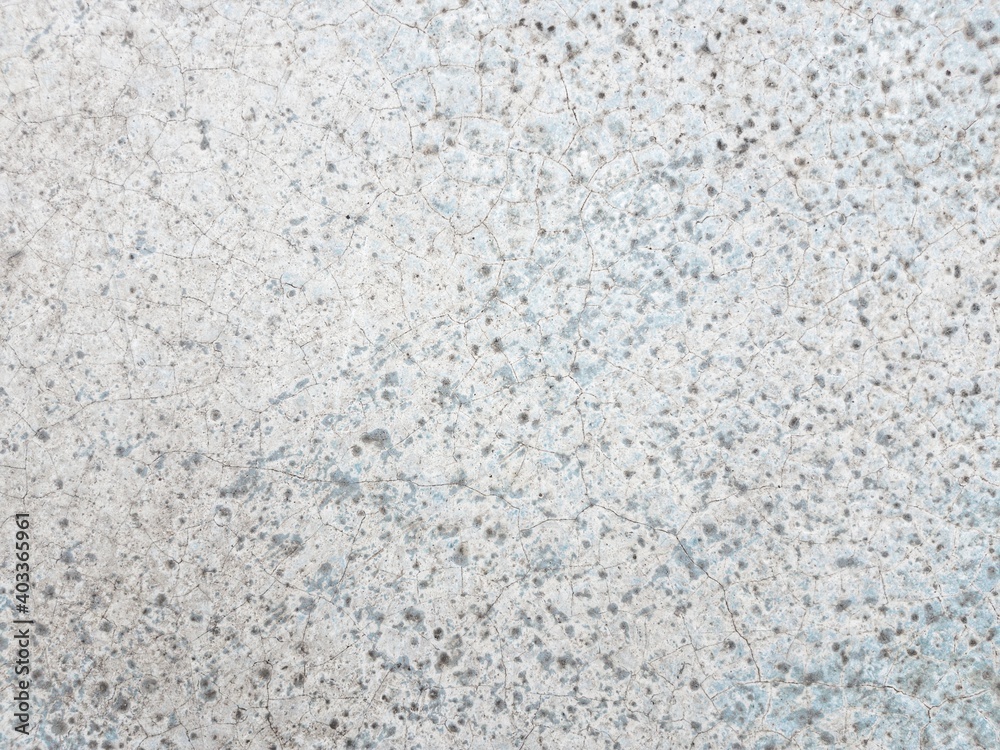Cracked cement texture in light grey earth tone for background. Close ...