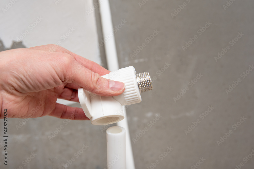 Connector of Plumbing pipes in the hand. Male threaded pipe fitting on ...