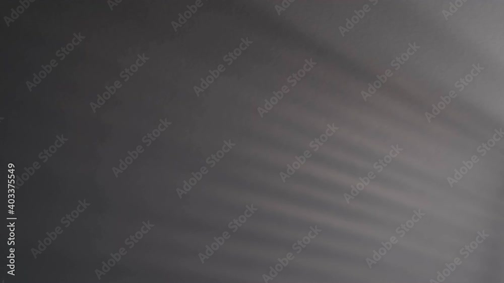 Blurry dark shadows moving on the wall. Spooky shadow art noise texture. closeup the motion of ...