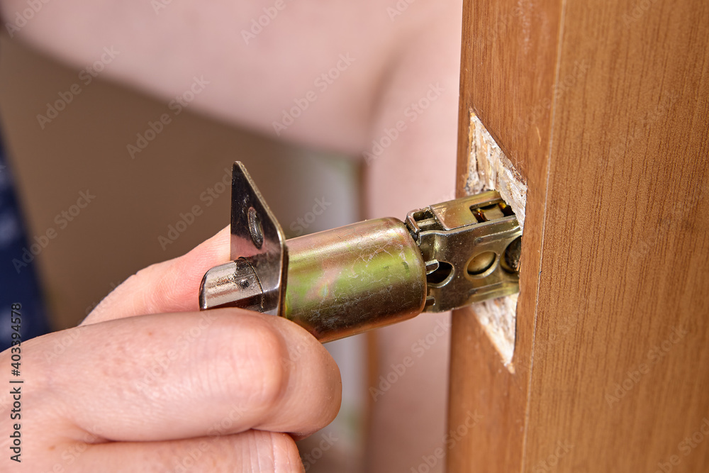 The latch mechanism assembly is inserted into the hole when installing ...