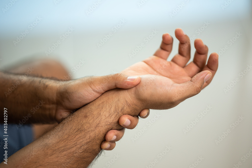 Close up male hand get hurt and pain in hand, wrist. Symptom office ...