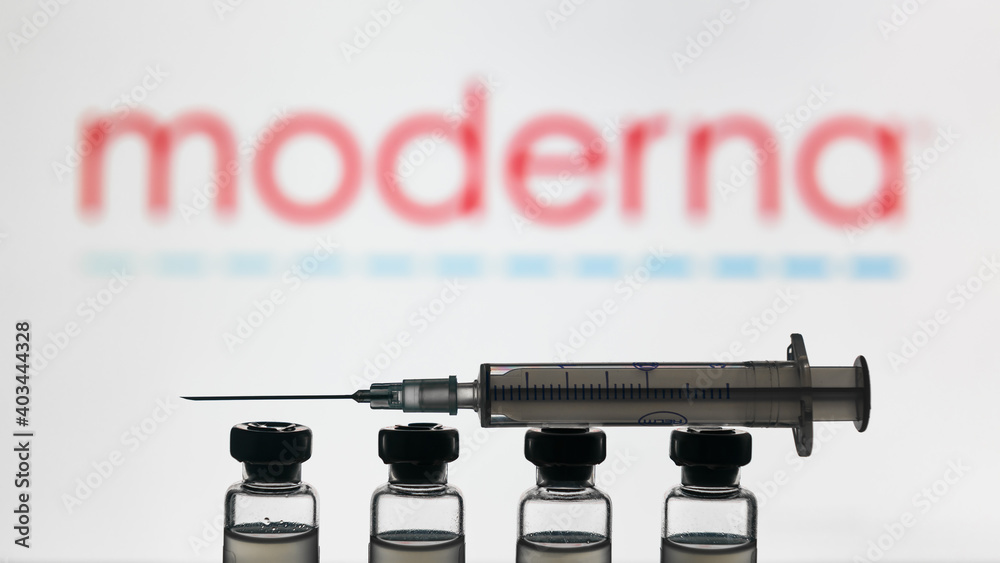 Moderna COVID-19 vaccine concept, syringe and bottles on logo ...