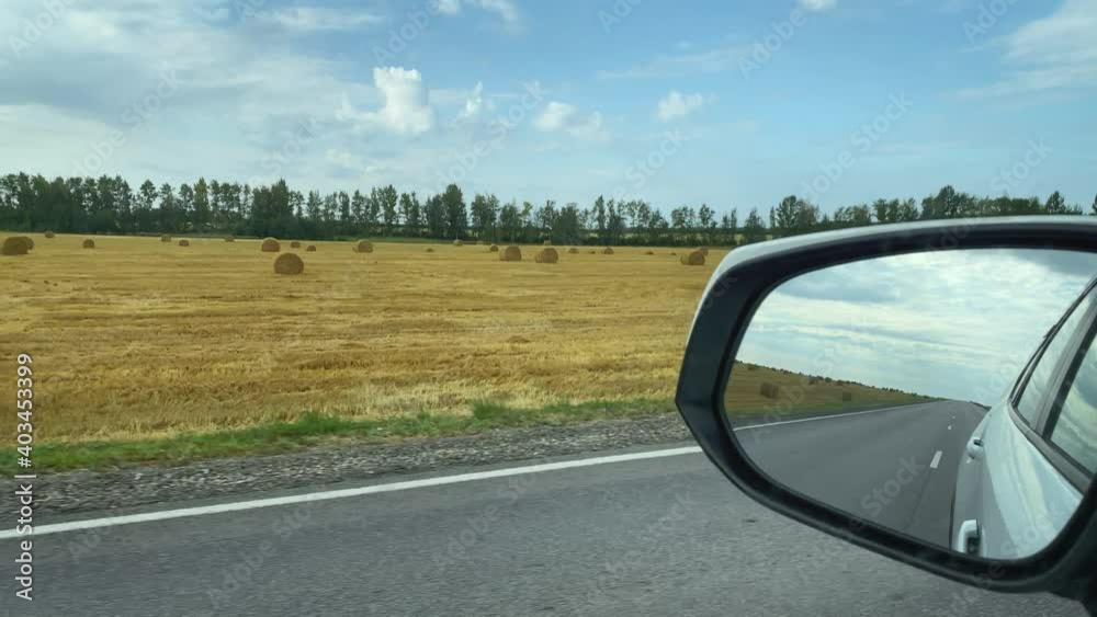 Picturesque view through the car window to empty road and natural ...