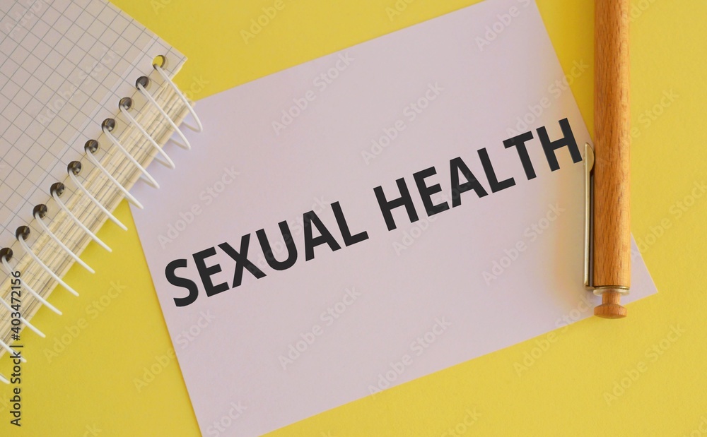 White paper with text Sexual Health on yellow background. Concept ...