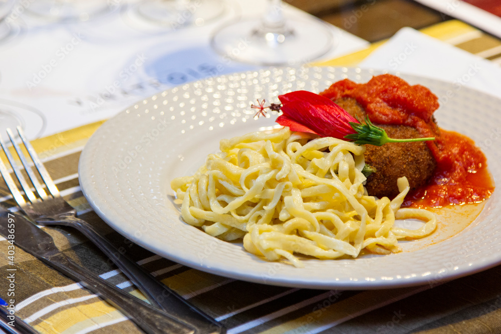 Spaghetti with chevre ballotine in sugo sauce. Stock Photo | Adobe Stock