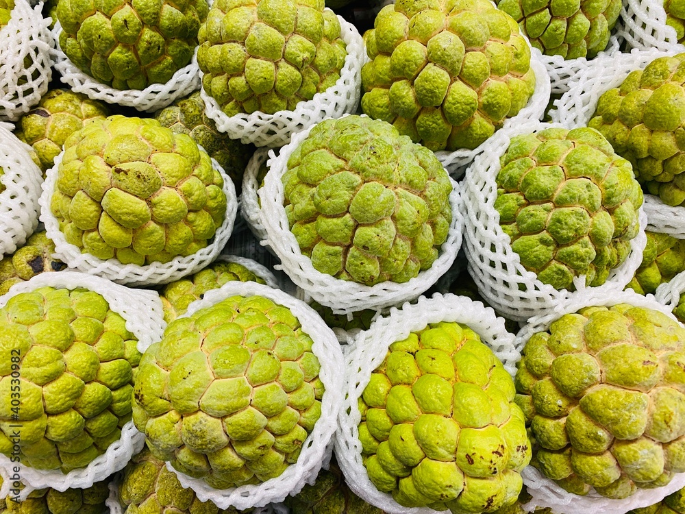 Close-up photo of Sugar Apple in market. Group of fruits background ...