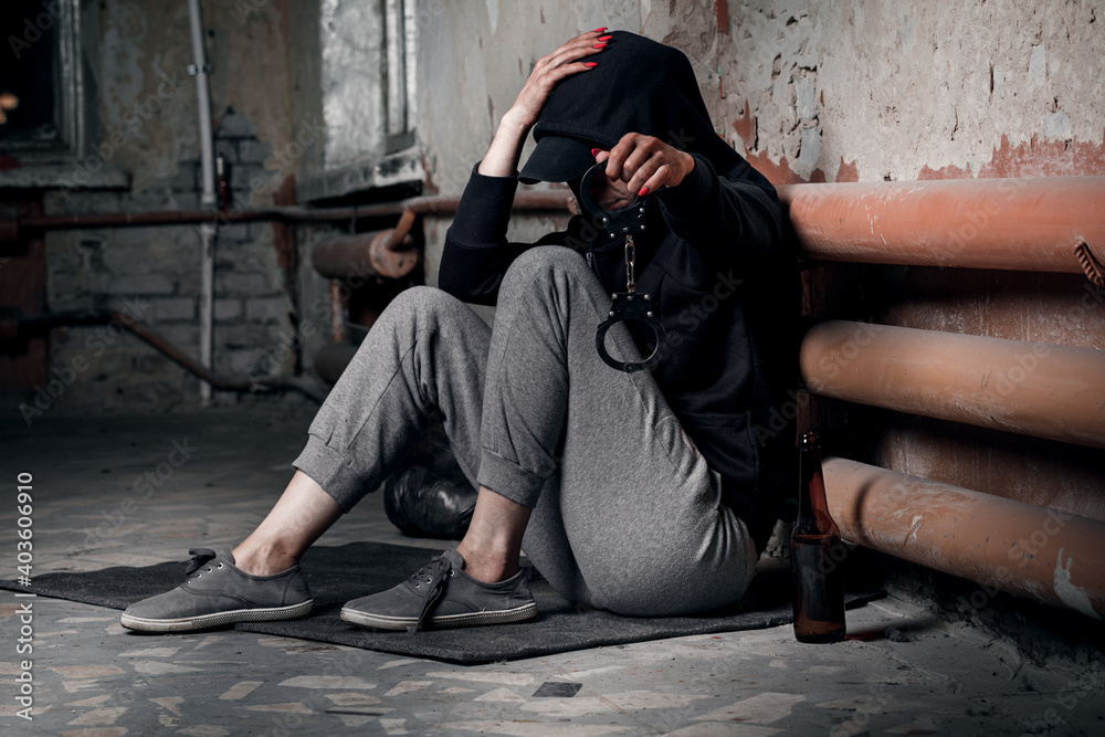 The concept of drug addiction and homelessness. A depressed and ...