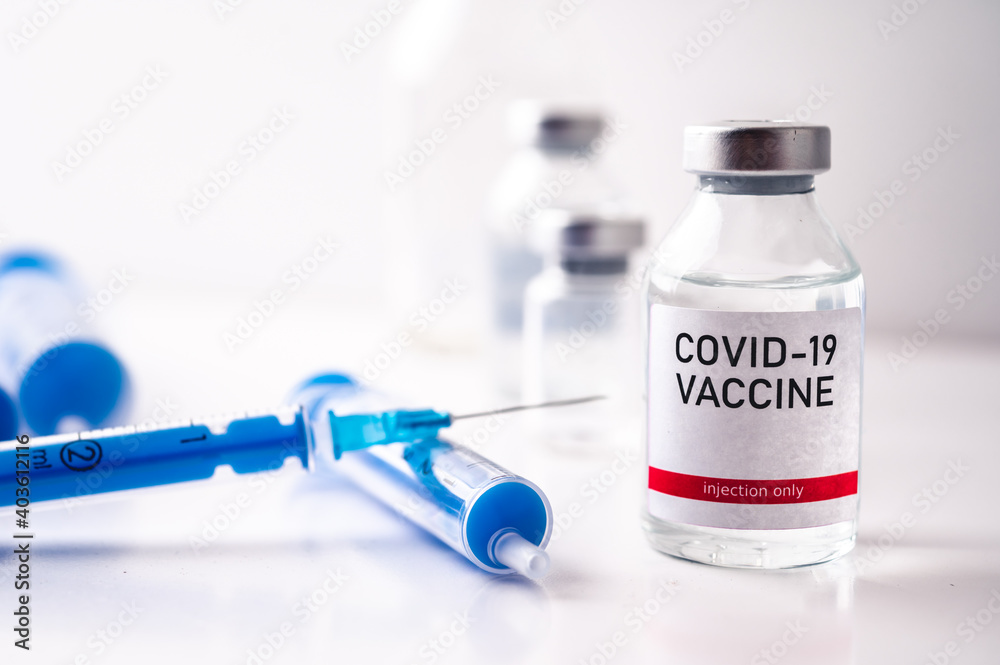 A single bottle vial of Covid-19 vaccine. Medical concept vaccination ...