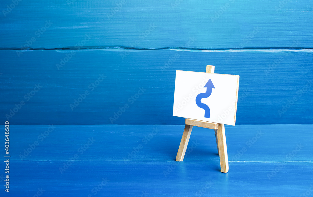 Foto de An easel with a curved arrow avoiding an obstacle. Deviation ...