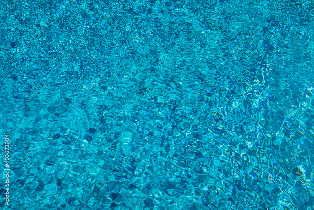 Blue ripped water in swimming pool. Surface of blue swimming pool ...