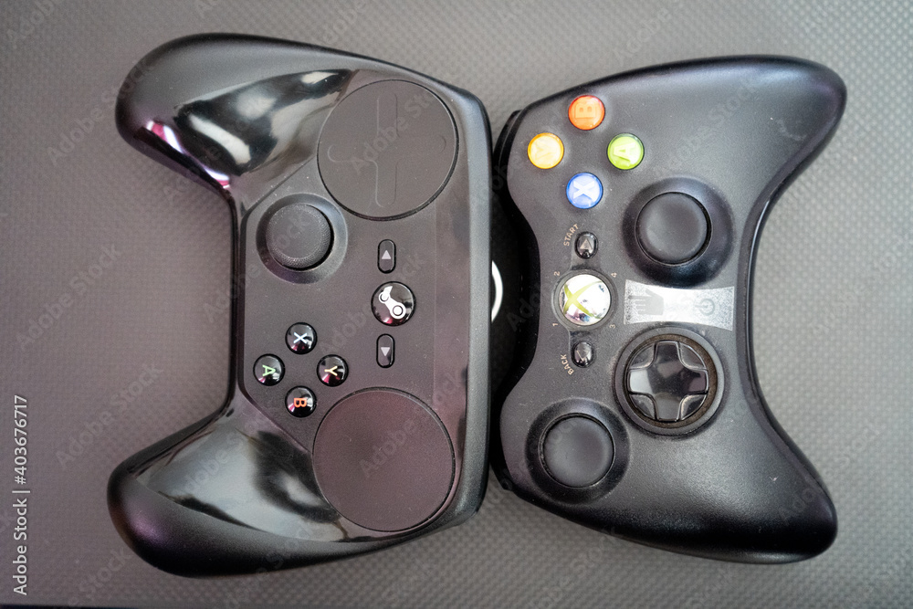 Xbox vs the steam controller on a carbon fiber background showing ...