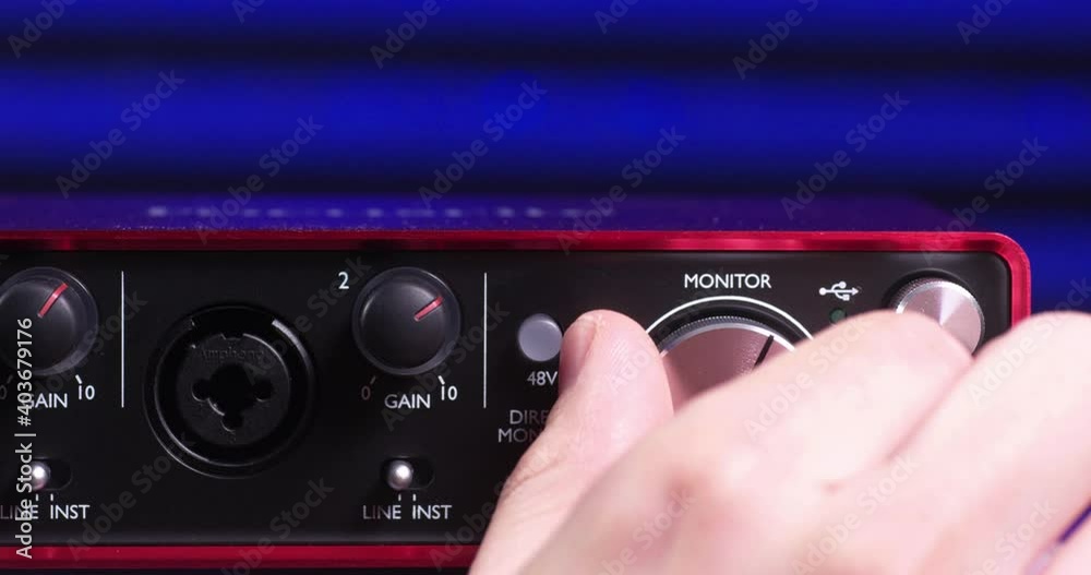 Adjusting gain and monitor audio level on sound mixer portable USB ...