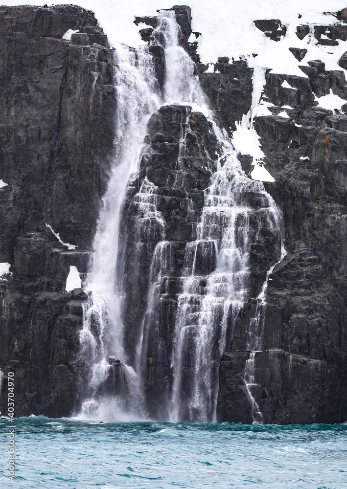 Melting water from glaciers and snow create stairstep waterfalls near ...