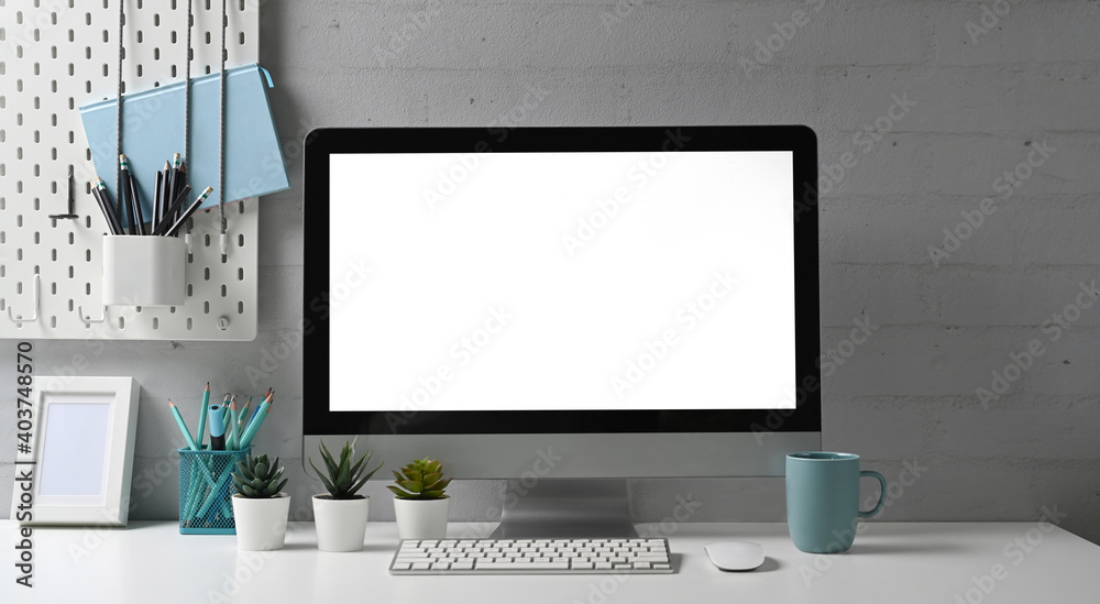 Front view of stylish workspace with mock up computer and office ...