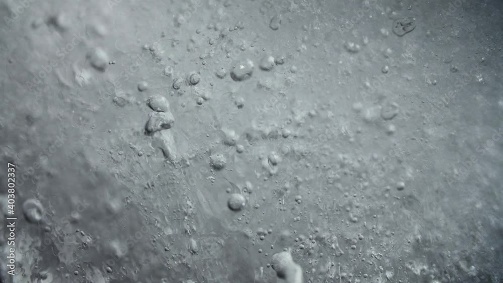 Cinematic macro time-lapse of frozen ice slowly melting. 4K background ...