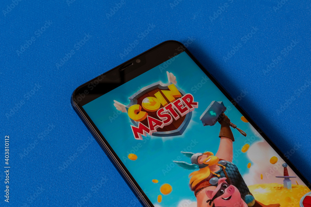 logo and application for the Coin Master game. Close-up with blue ...