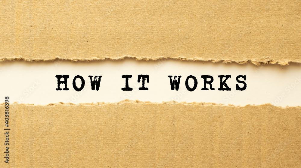 Text HOW IT WORKS appearing behind torn brown paper. Top view. Stock ...