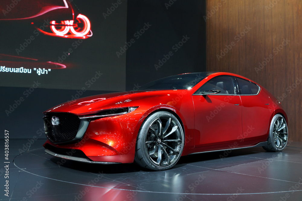Stylish metallic red Mazda car display at the Bangkok International ...