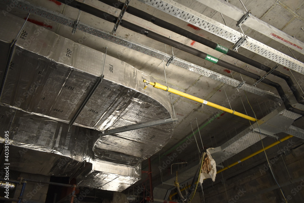 MEP works in civil construction site. Aluminum fabricated air flow duct ...