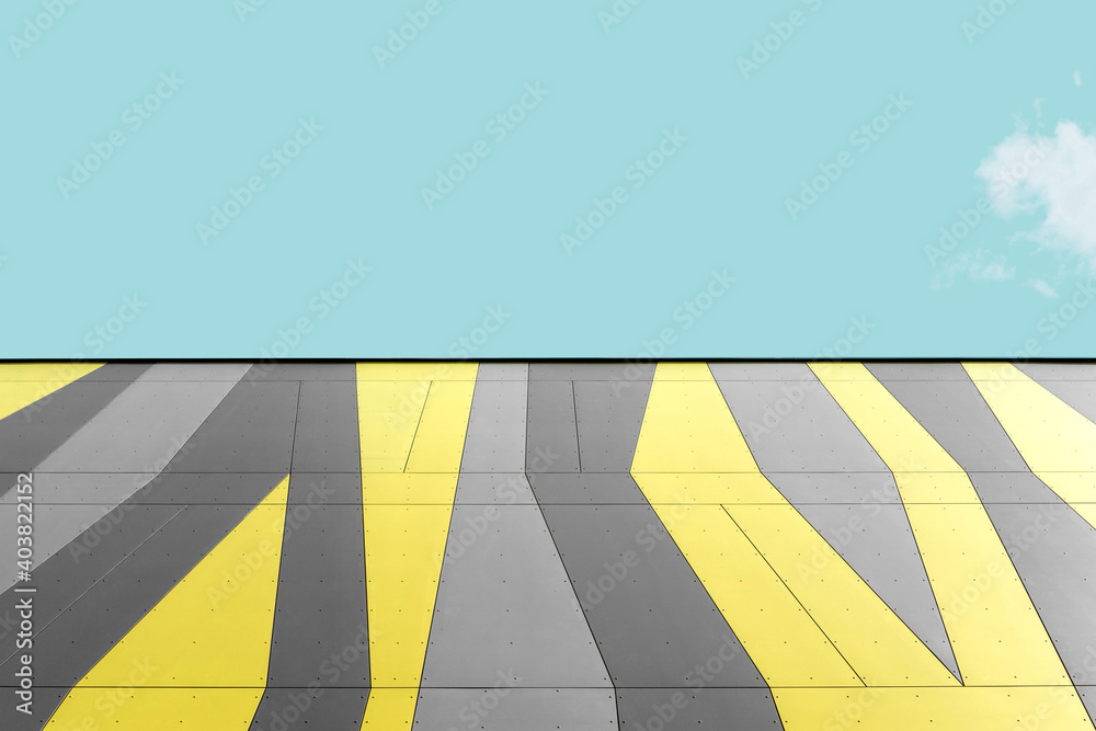 Light Gray, Dark Grey and Yellow Cladding Facade Panels under Teal Blue ...