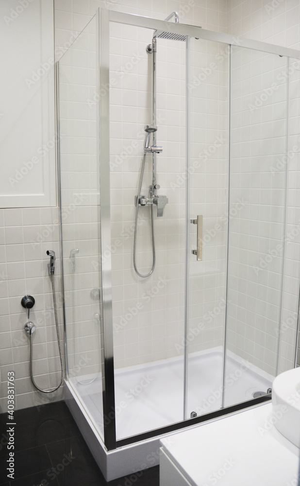 A close-up of a modern rectangular shower enclosure, cubicle, cabin ...