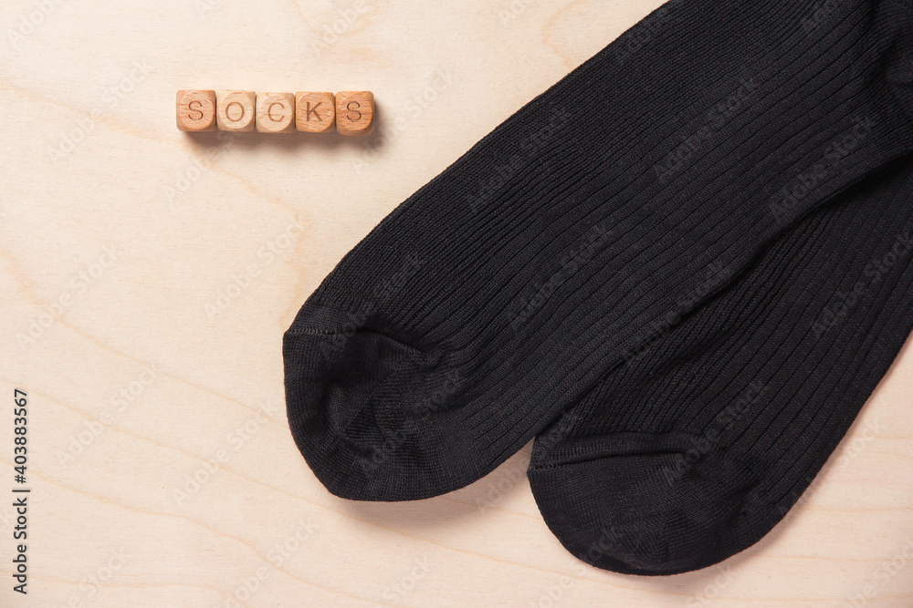 Word denoting socks consists of wooden cubes with letters. Wooden cubes ...