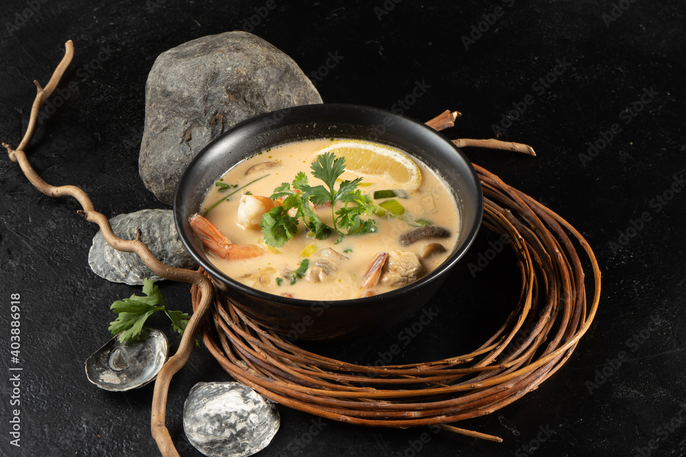 Tom yum soup with mussels and shrimps. Hot spicy classic Asian soup ...