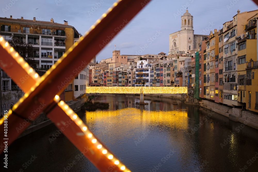 Girona's urban cityscape skyline at dusk with famous gothic cathedral ...