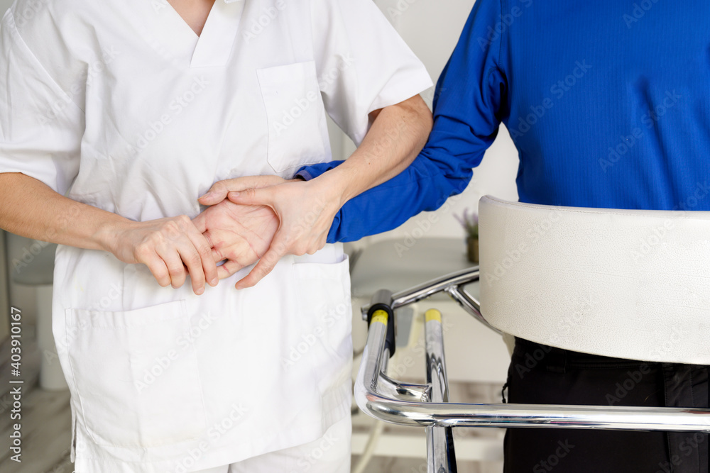 female nurse caregiver, holding patient hand, support disabled patient ...