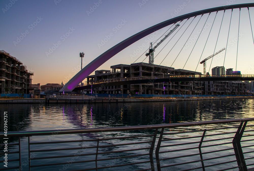 Dubai, UAE - 01.08.2021 Bridge over a Dubai Water canal known as ...