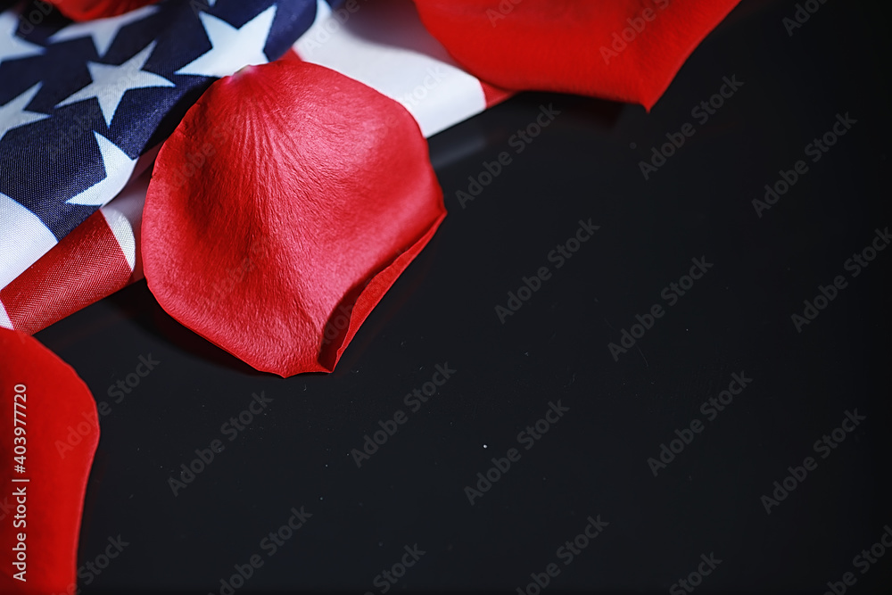 American flag and rose flower on the table. Symbol of the United States ...