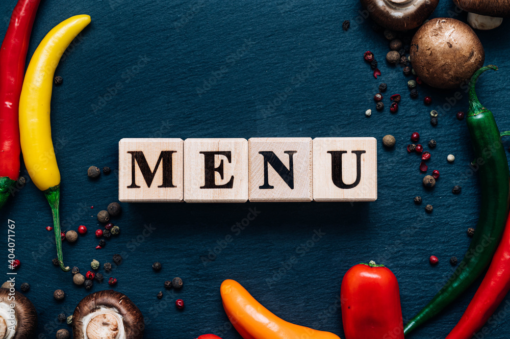 MENU text or word written in wooden blocks and vegetables isolated on ...