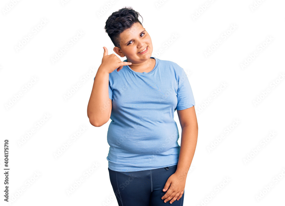 Little boy kid wearing sports workout clothes smiling doing phone ...