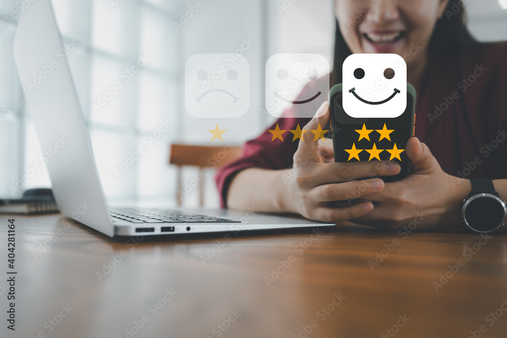Customer service evaluation concept. smiling Asian female Is using a ...