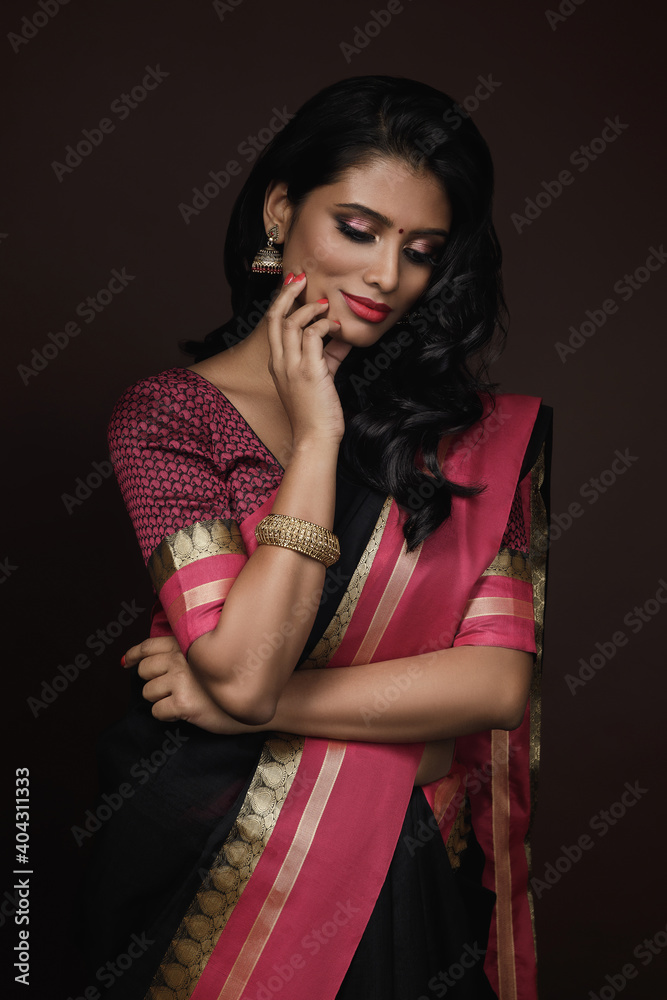 Beautiful Indian woman wearing traditional sari dress Stock Photo ...
