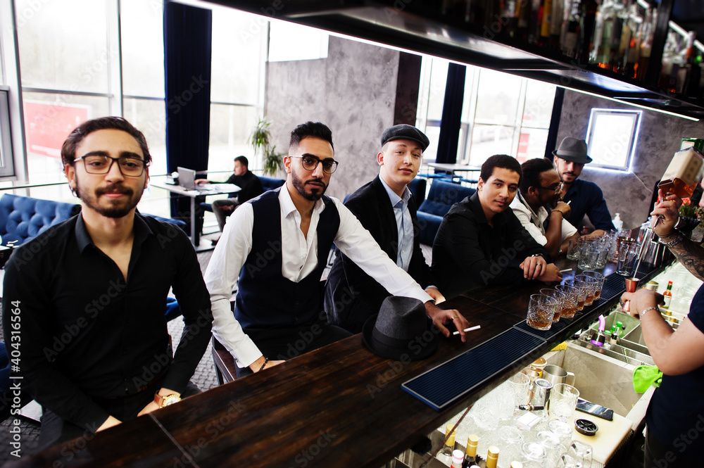 Group of handsome retro well-dressed man gangsters spend time at club ...
