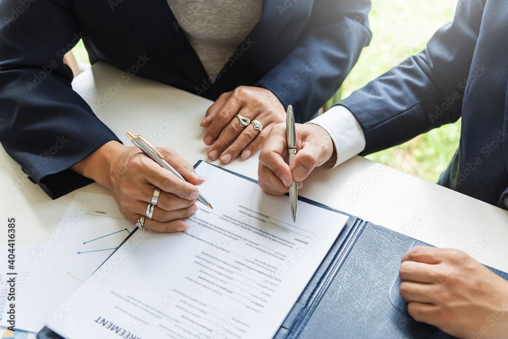 Signing a business contract. Group of business people at the meeting ...
