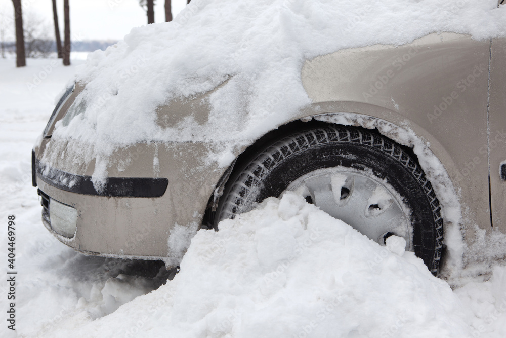Wheel of a car buried in snow , wheels car in deep snow Stock Photo ...