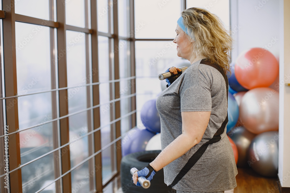 Fat woman dieting, fitness. Portrait of obese woman working out in gym ...