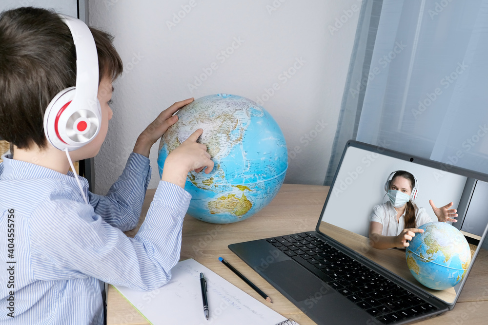 At home cute boy doing his online school classes he have a conversation ...