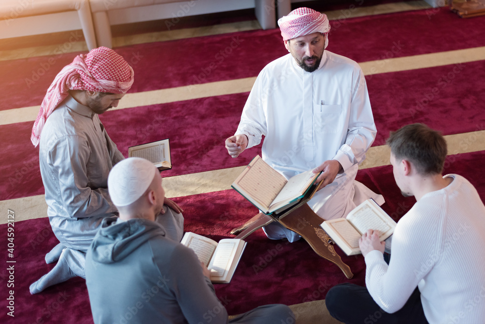Group of Muslim people in mosque reading Koran Stock Photo | Adobe Stock