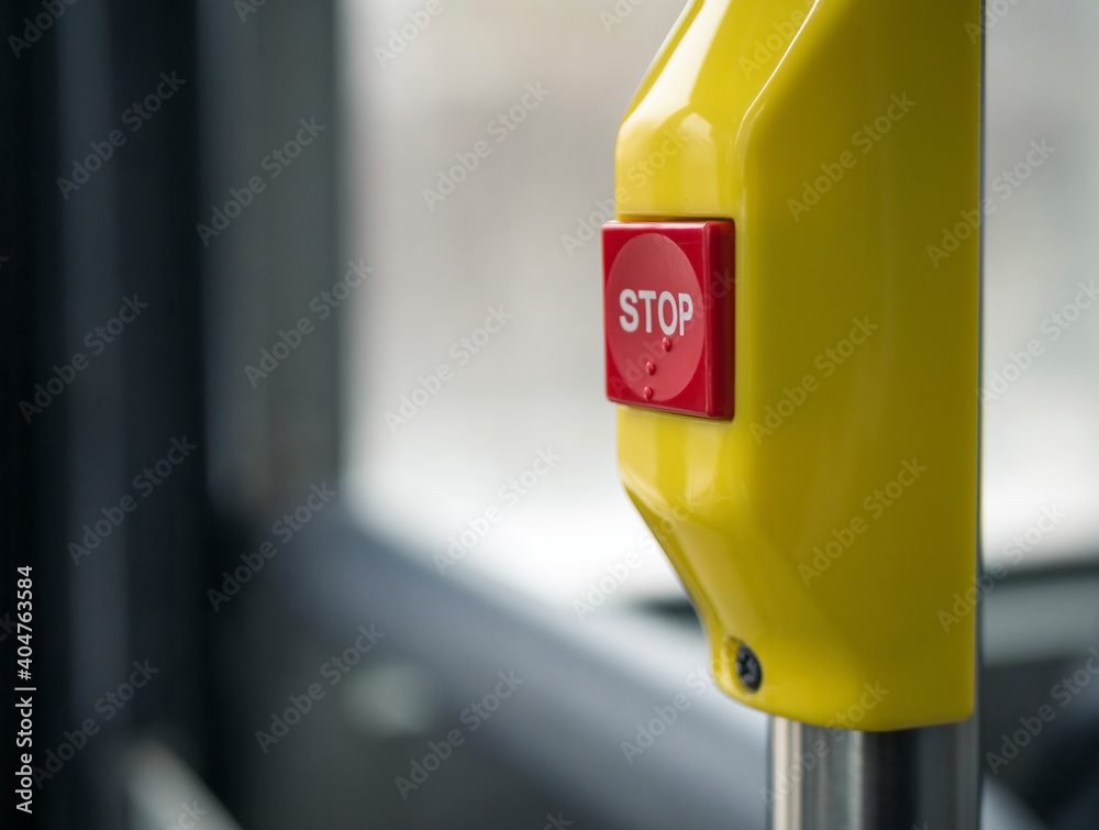 Red stop button in the public buses. Stock Photo | Adobe Stock