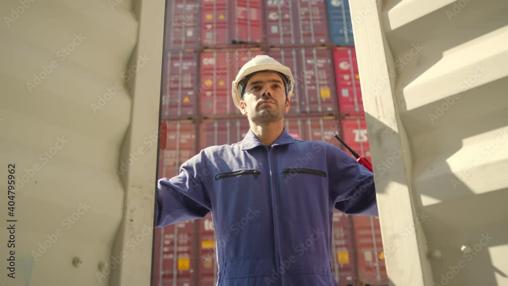 Caucasian senior worker docker hand open container cargo for checking ...