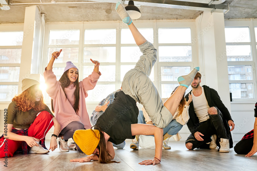 break dancer woman showing different tricks and movements while dancing ...