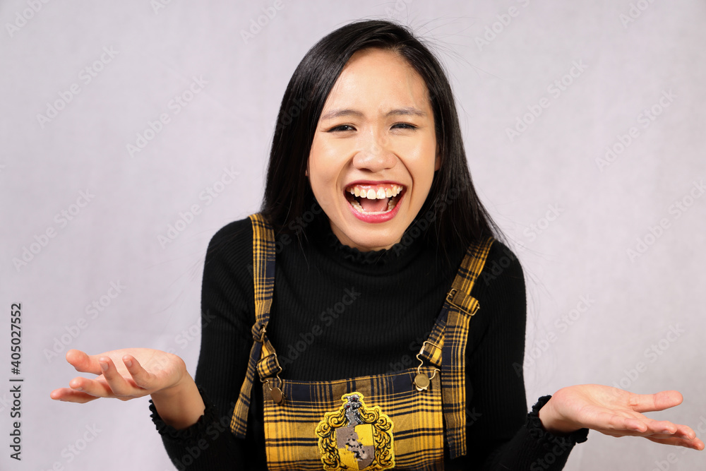 Young attractive southeast Asian woman posing facial expression ...