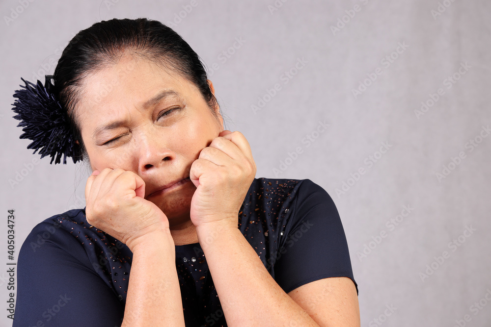 Elderly senor Asian woman posing facial expression sad crying hand on ...