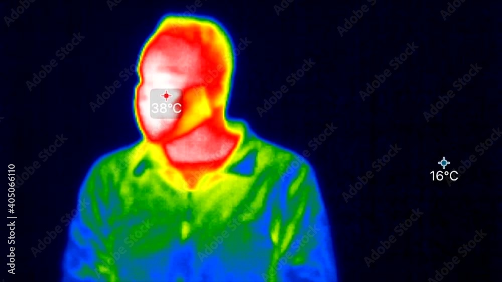 Thermal imaging camera detecting elevated temperature. Sick man with ...